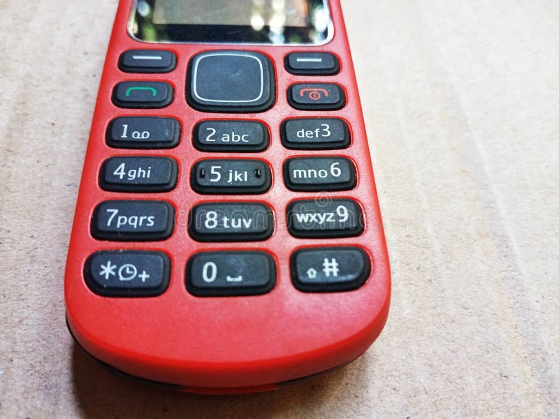 Hand Holding Old Mobile Phone with Texting or SMS Button Keyboard or ...