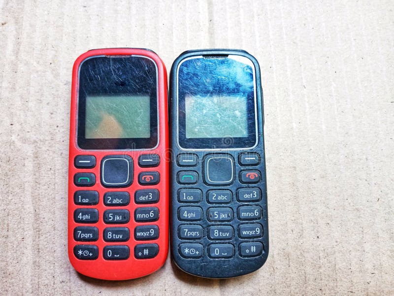Hand Holding Old Mobile Phone with Texting or SMS Button Keyboard or ...