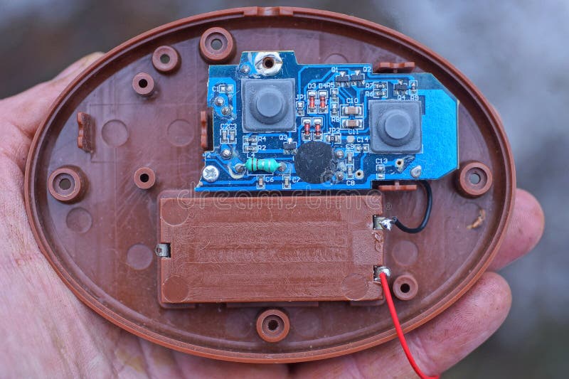 Hand Holding One Brown Plastic Open Electrical Appliance Box with Blue ...