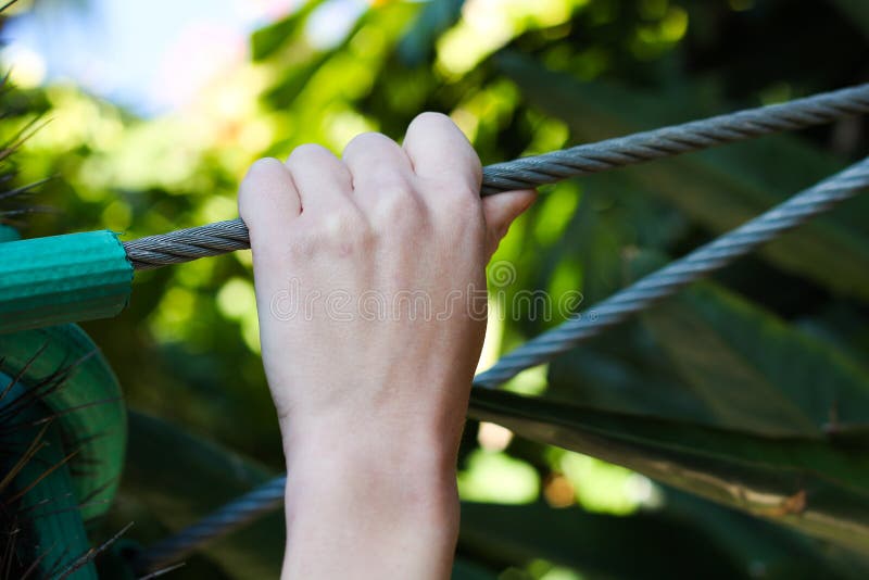 Hand Holding Onto a Wire Cable Stock Image - Image of fingers ...