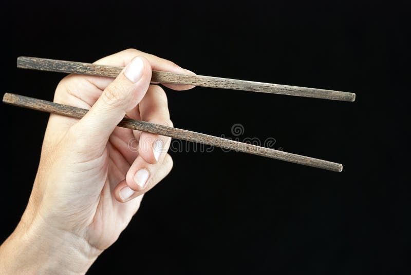 Hand Holding Open Chopsticks Stock Photo - Image of hand, buffet: 33353056