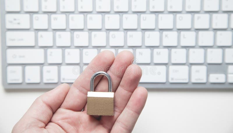 Hand Holding Padlock Over Computer Keyboard Stock Photo - Image of ...