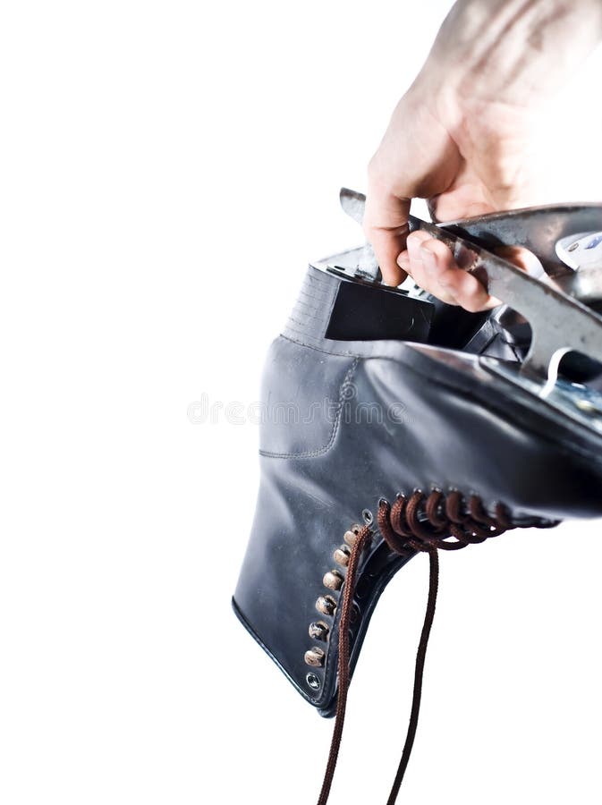 Hand Holding a Pair of Figure Skates Stock Photo - Image of shoes ...