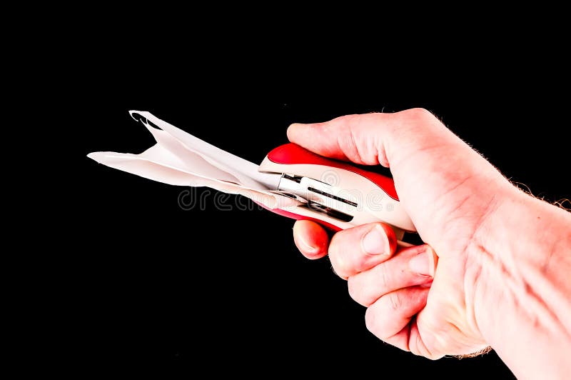 A Hand Holding a Pair of Scissors with a Red Handle Stock Photo - Image ...