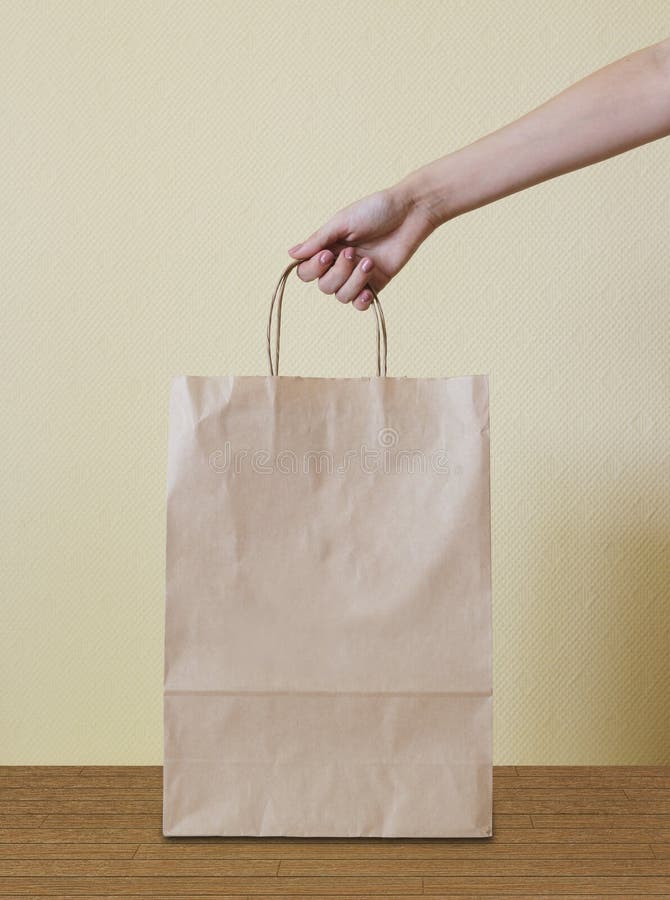 Hand Holding Paper Bag Wooden Floor Stock Photos - Free & Royalty-Free ...