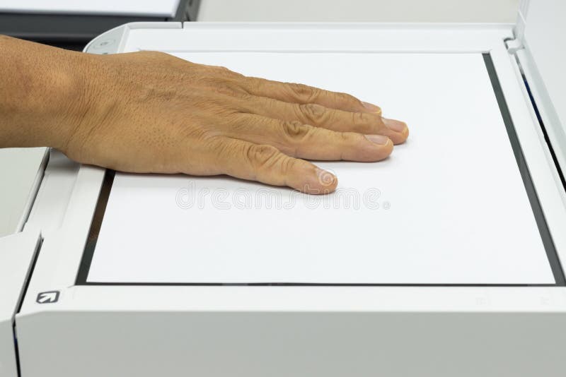 Hand Holding a Paper, Inserting a Scanner Concept Scanner for Office ...