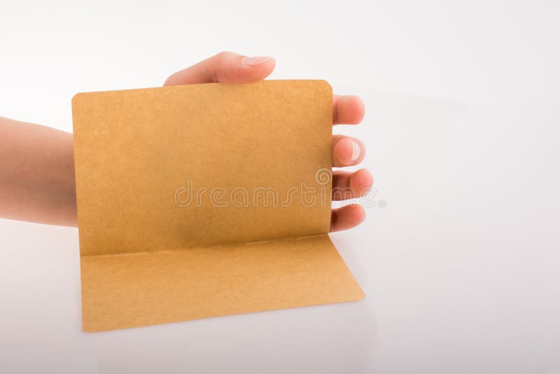 Hand holding a paper stock image. Image of classroom - 145818595
