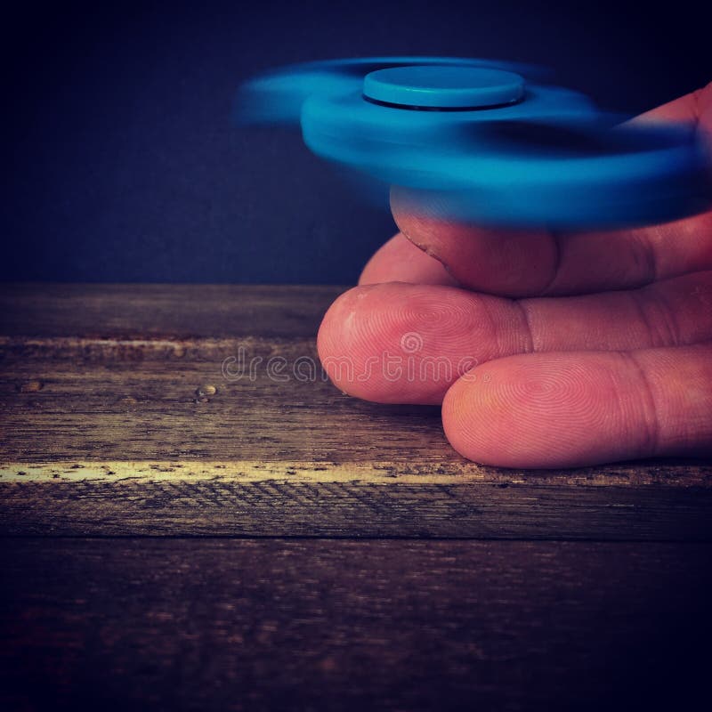 Hand Holding Peg Top Picture. Image: 95354903