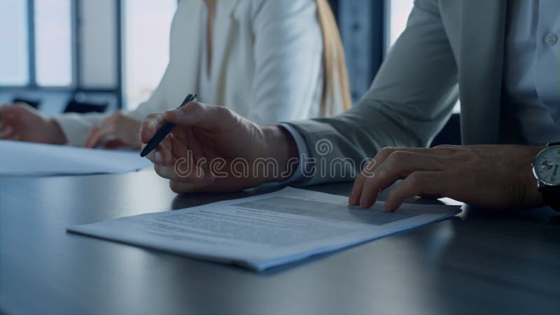 Hand Holding Pen Checking Document Closeup. Employee Reading Contract ...