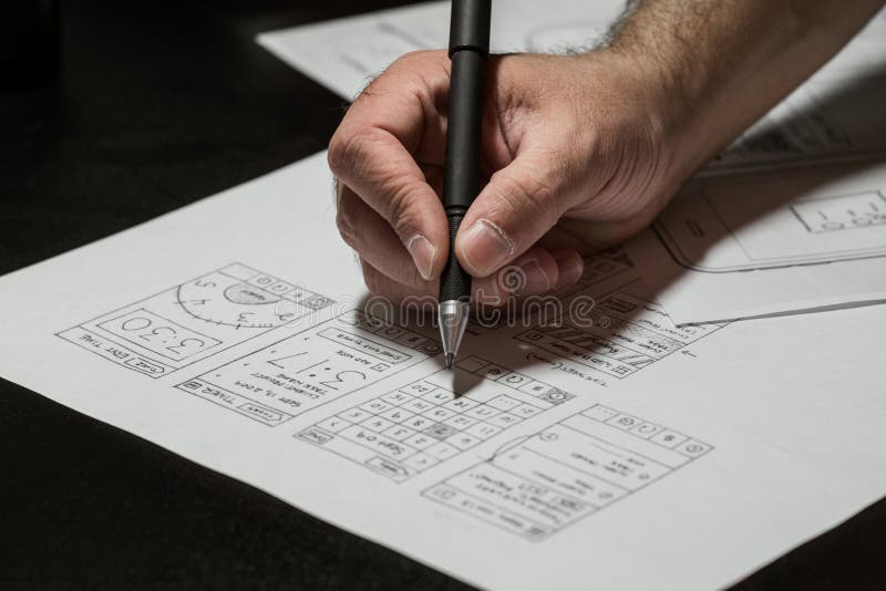 Hand Holding a Pen and Looking Project Stock Image - Image of ...