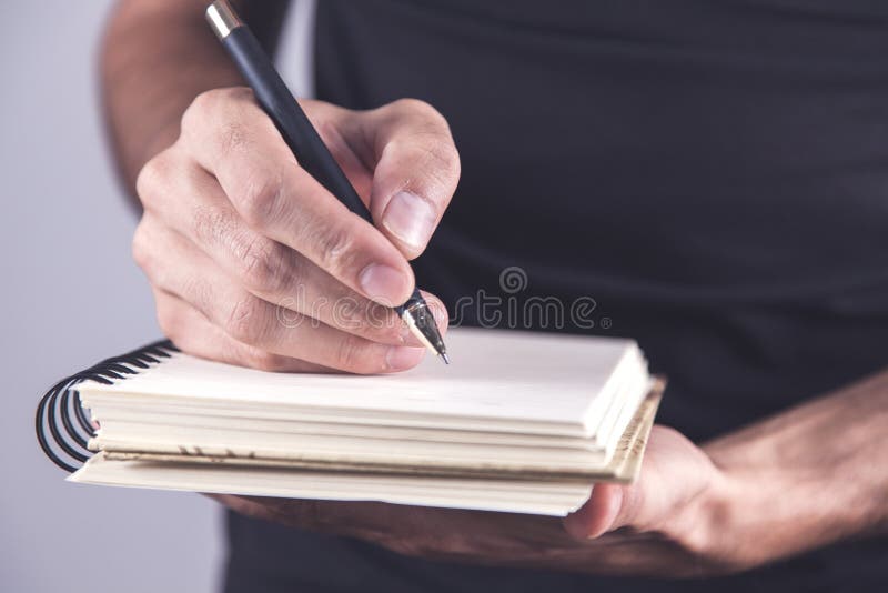 Hand Holding Pen with Notepad Stock Image - Image of office, student ...