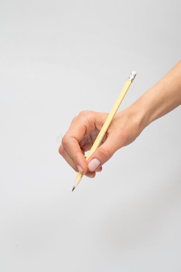 Hand Holding a Pencil Ready To Write on a Light Background Stock Photo ...