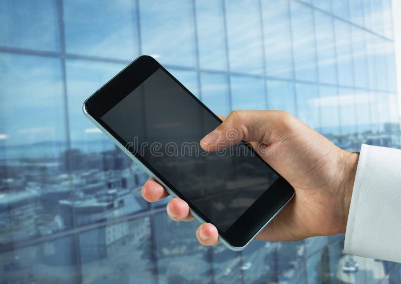 Hand Holding Phone in Front of Building Stock Image - Image of holding ...