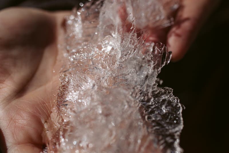Hand Holding a Piece Glacial Ice. Macro View of Ice in Hand Stock Image ...