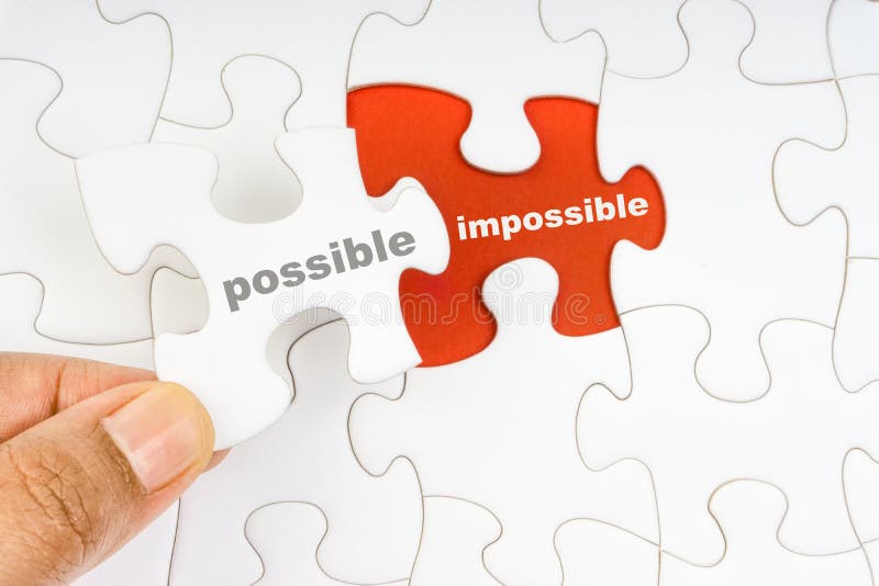 Hand Holding Piece of Jigsaw Puzzle with Word POSSIBLE IMPOSSIBLE Stock ...