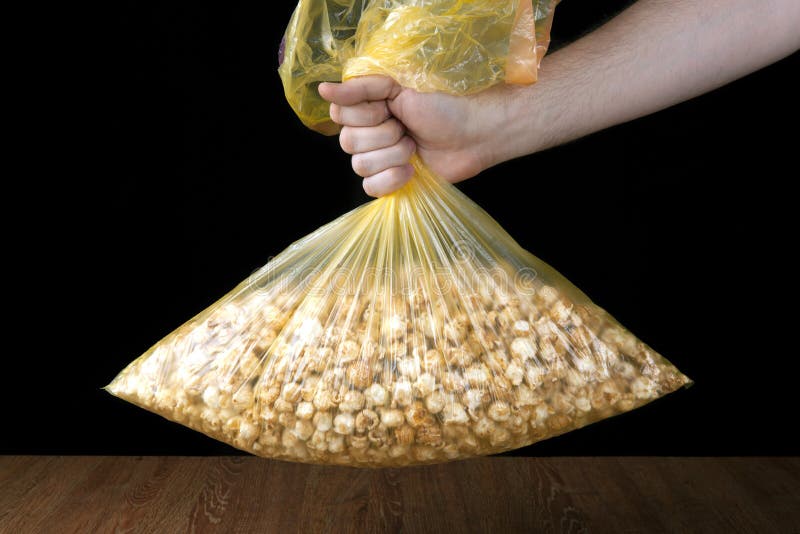 Hand Holding Plastic Bag Popcorn Stock Photos - Free & Royalty-Free ...