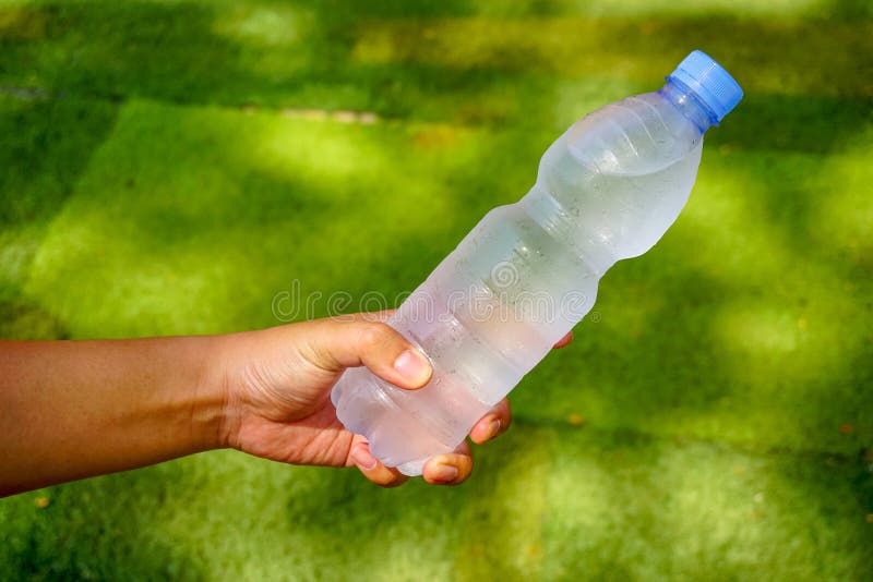 Hand Holding Plastic Water Bottle. Fresh Water in the Bottle Stock ...
