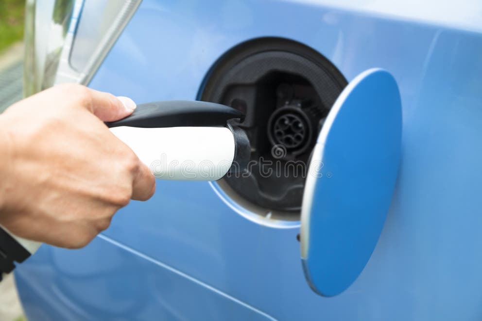 Hand Holding Plug for Charging Electric Car Stock Image - Image of ...
