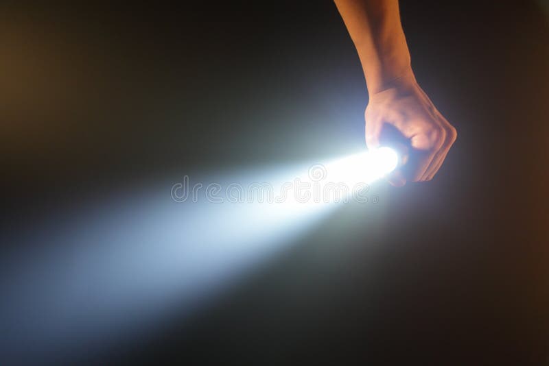 Hand holding flashlight stock image. Image of beam, lite - 4062097