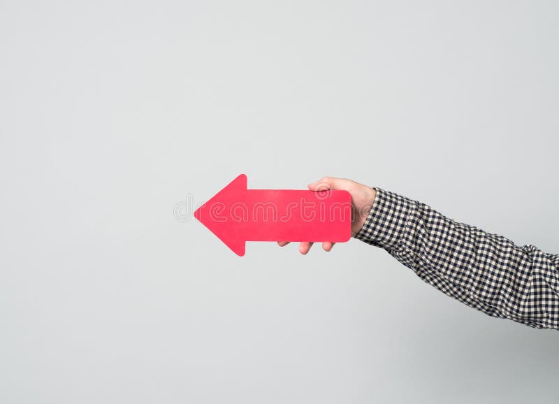 Hand holding red arrow stock photo. Image of indicator - 100683838