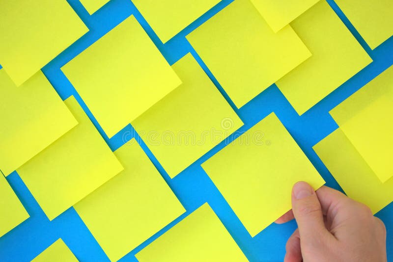 Hand holding post-it note stock photo. Image of reminder - 130946146