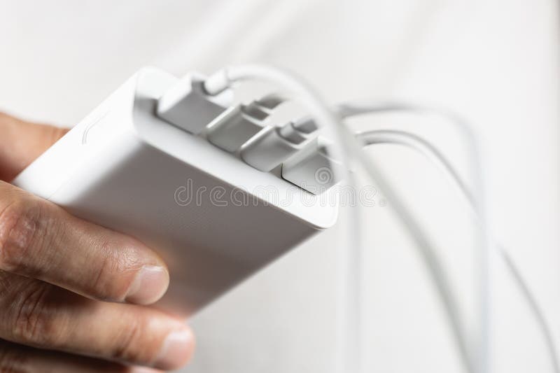 Hand Holding Powerbank with Cable. Power Saving Device Power Bank Stock ...