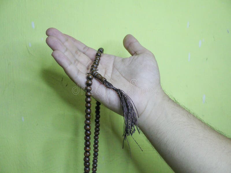 Hand holding prayer beads stock image. Image of harmony - 304918745