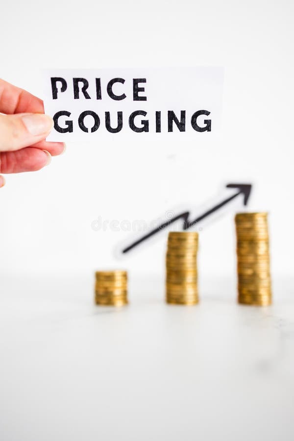 Hand Holding Price Gouging Text in Front of Growing Stacks of Coins ...