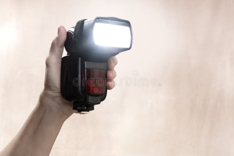 Hand Holding Radio-Triggered Electronic Flash with Copy Space Stock ...