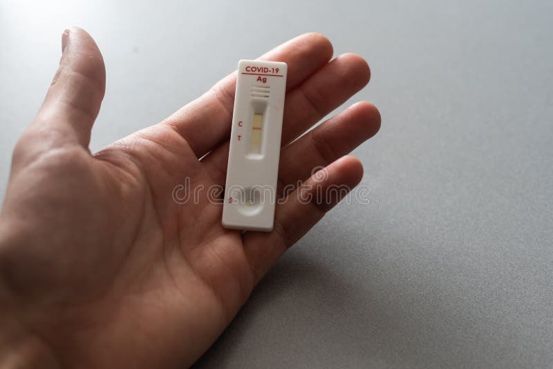 Hand Holding Rapid Coronavirus Covid-19 Negative Test Device with ...