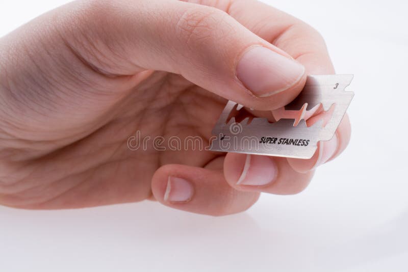 1,009 Hand Holding Razor Blade Stock Photos - Free & Royalty-Free Stock ...