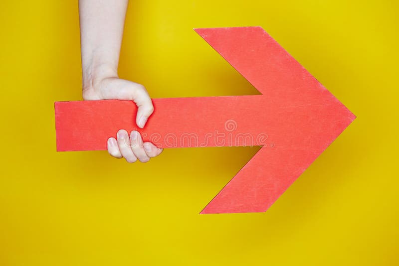 Hand Holding Red Arrow To the Right Stock Photo - Image of business ...