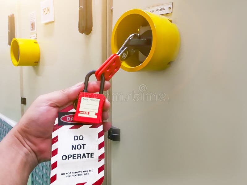 Theâ€‹ Hand Holding Red Key Lock and Tag for Process Cut Off Electrical ...