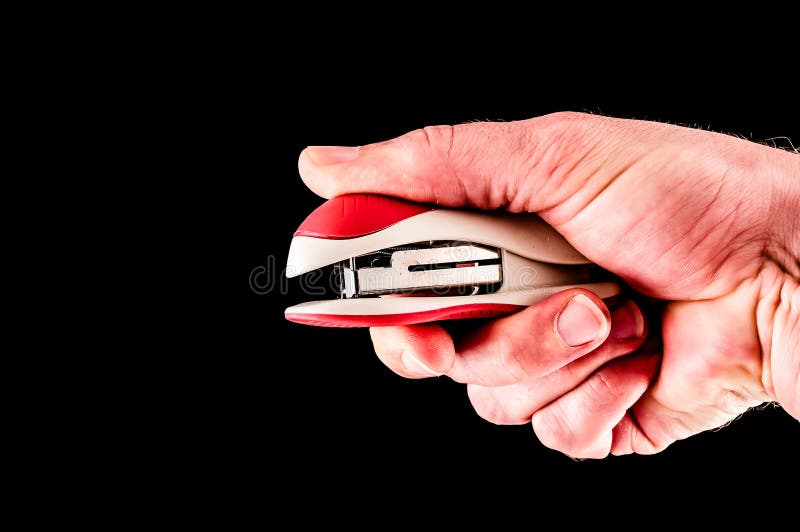 A Hand Holding a Red and White Stapler Stock Photo - Image of closeup ...