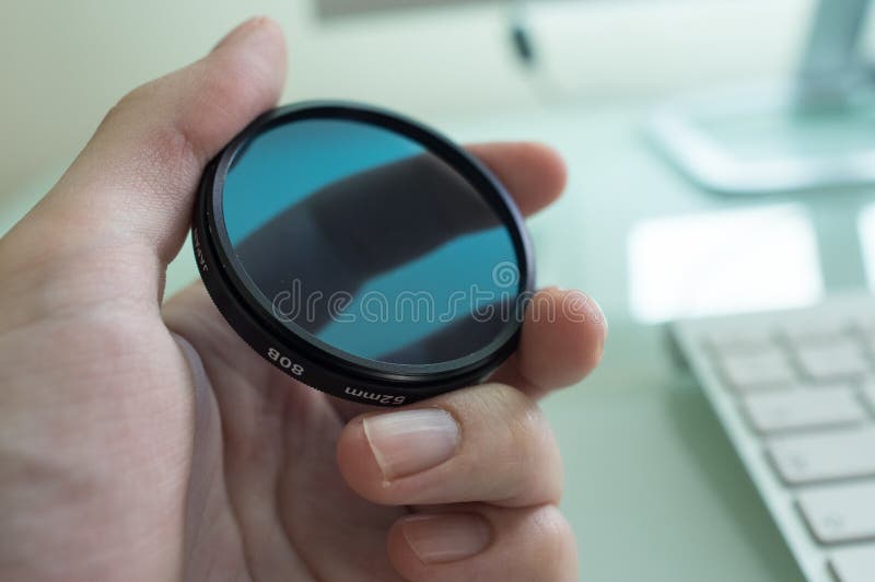 Hand Holding a Reflex Camera Blue Filter Stock Image - Image of depth ...