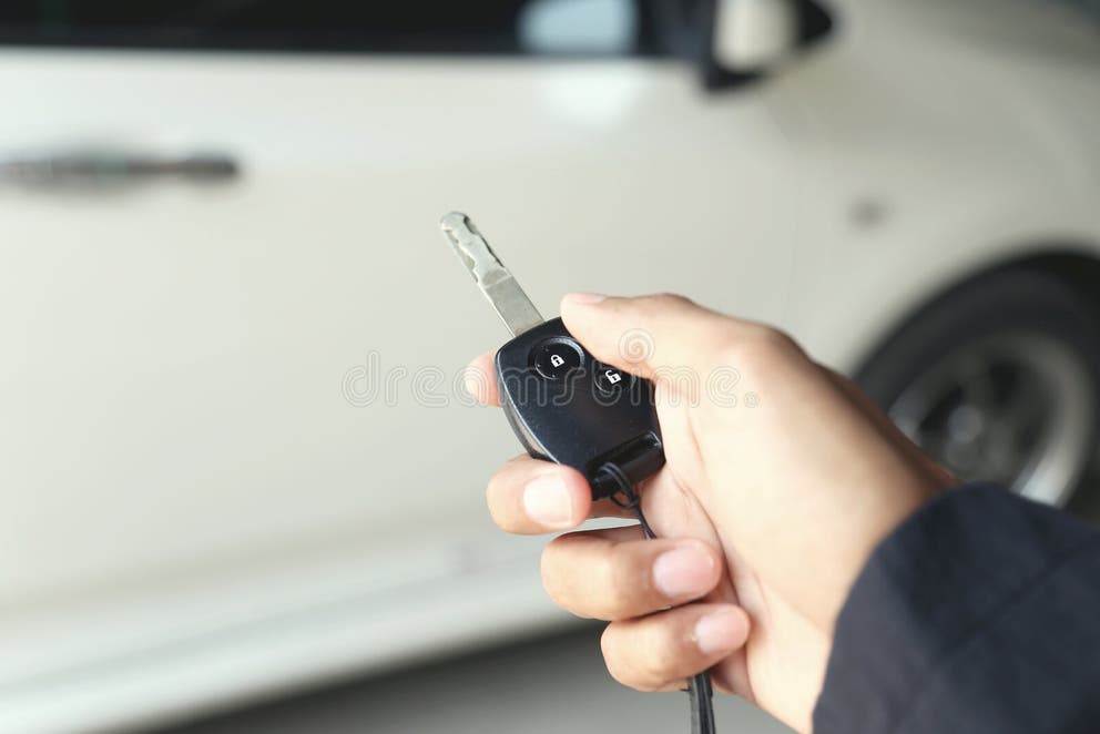 Hand Holding Remote Control Car Key Stock Image - Image of control, security: 69883115