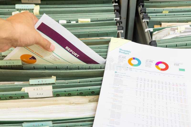 Hand Holding Report File in Filing Cabinet Stock Photo - Image of ...
