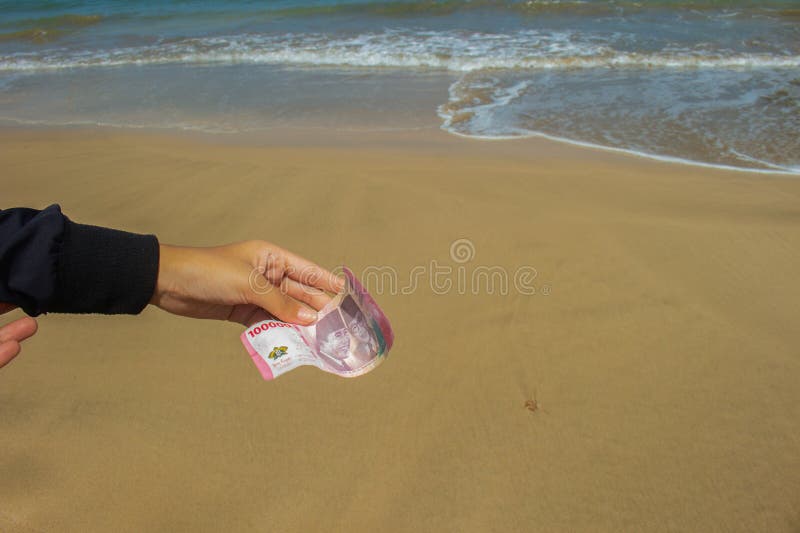 Hold Money on the Shoreline with Ocean Breeze Stock Image - Image of ...