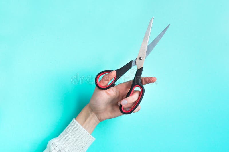 Hand holding Scissors stock photo. Image of blue, black - 164909536