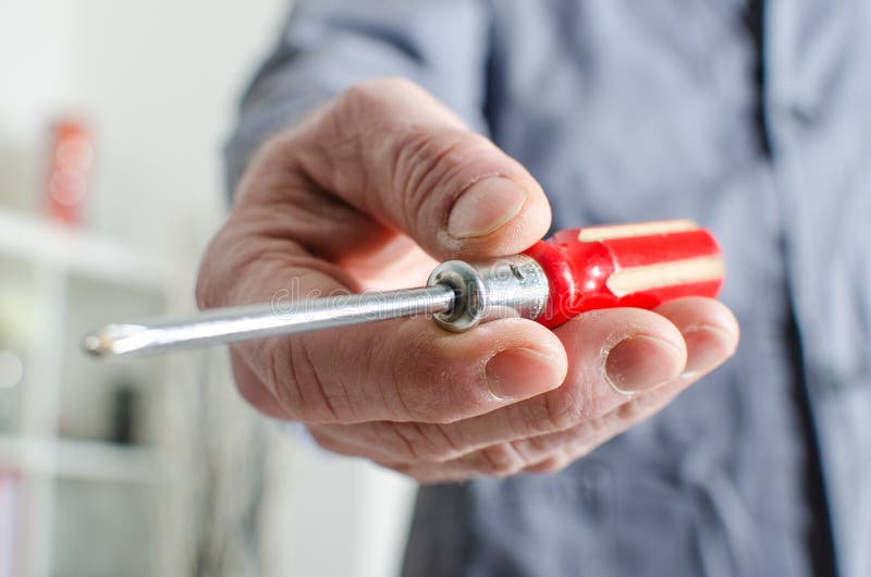 Hand holding a screwdriver stock photo. Image of holding - 51488732