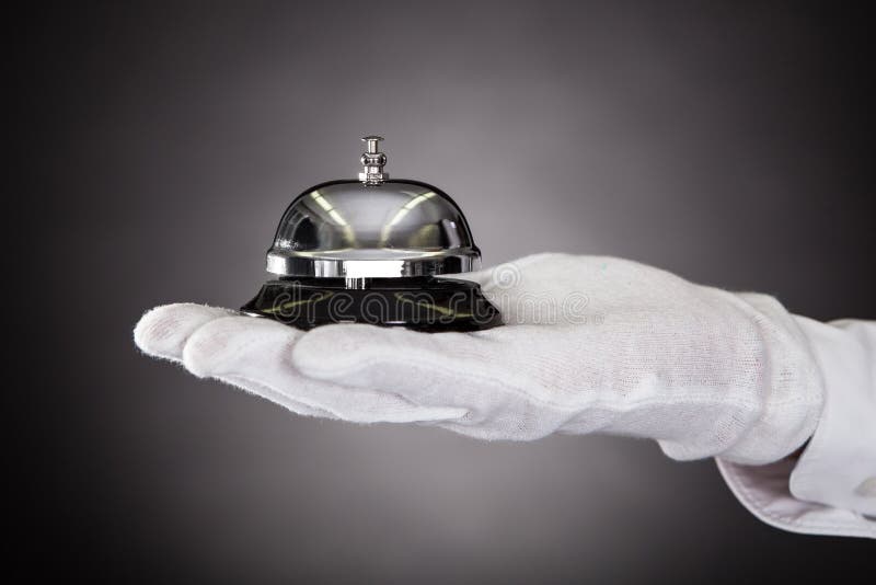 Hand Holding Service Bell stock image. Image of alarm - 34959425