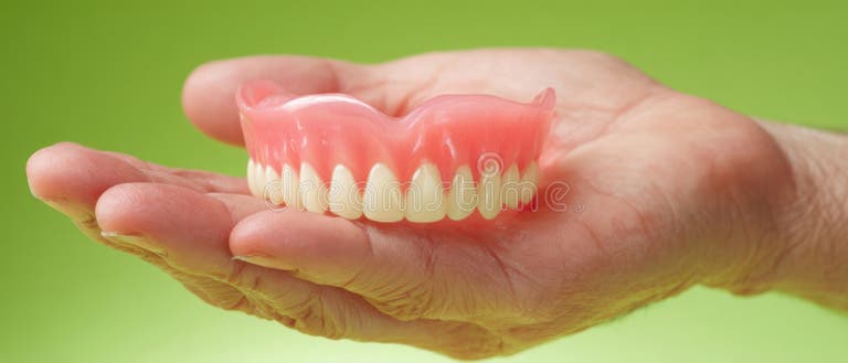 The Hand Holding a Set of Beautifully Crafted Dentures AI Generated ...