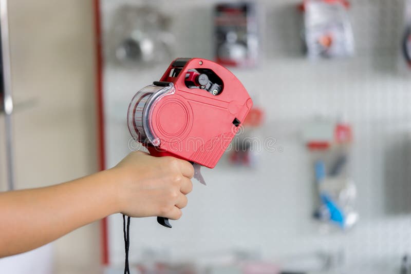 Hand Holding Shop Pricing Gun Stock Photo - Image of finance ...