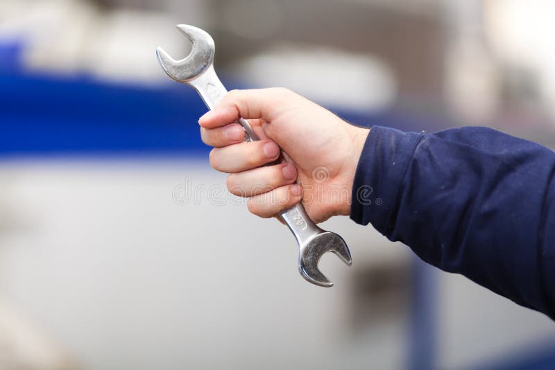Hand holding wrench stock photo. Image of equipment, plier - 22574002