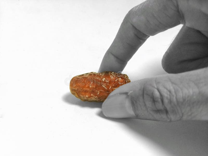 Hand Holding Single Date Fruit White Background Stock Photos - Free ...