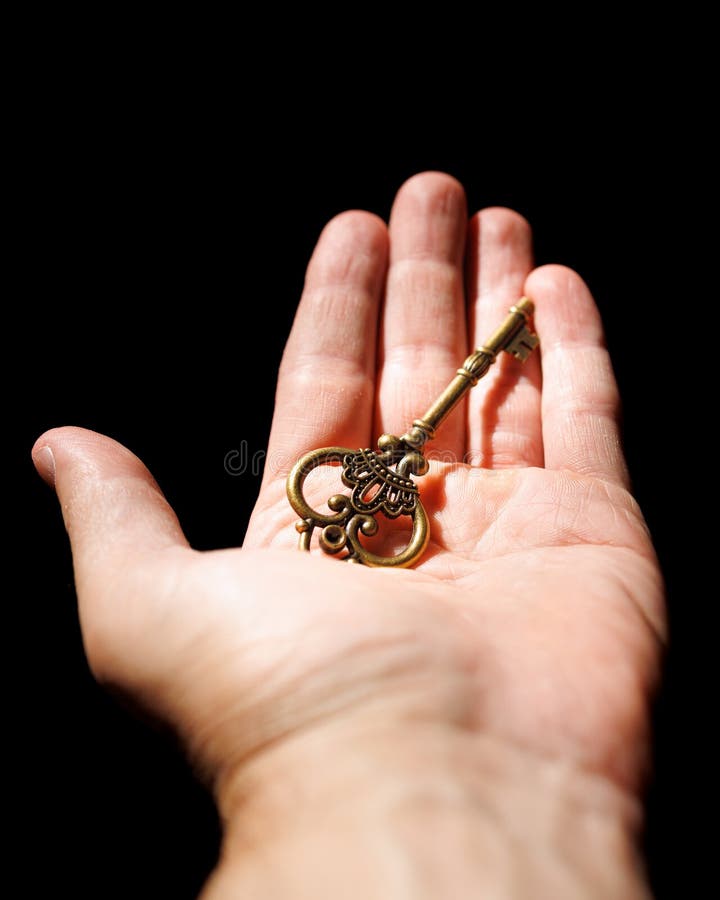 Hand Holding Antique Vintage Skeleton Key Against Black Background ...
