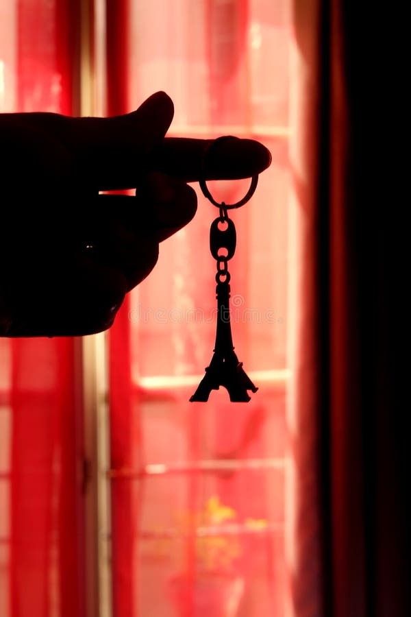 Hand Holding Small Eiffel Tower Silhouette Stock Image - Image of metal ...