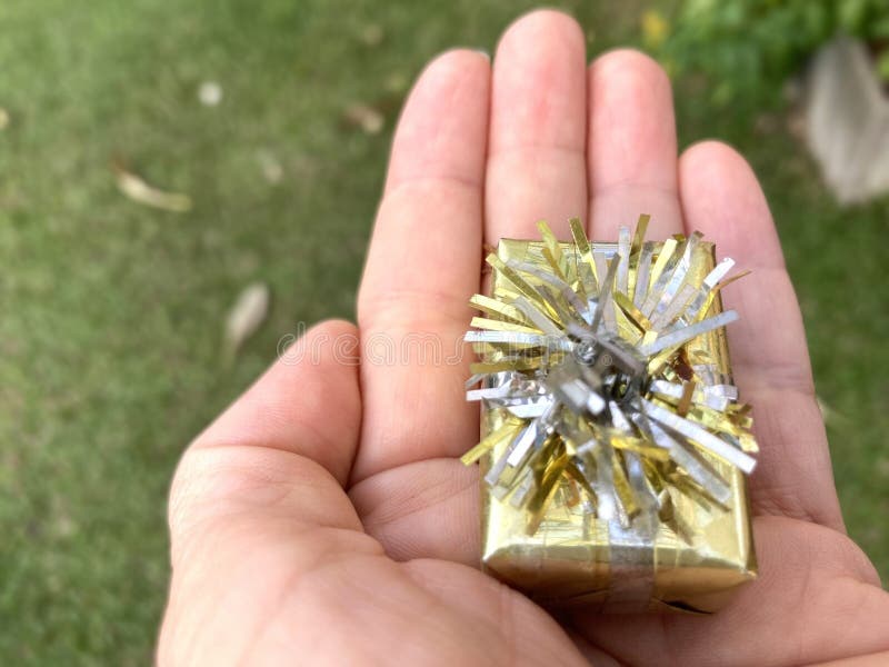 Small Golden Favors for Candy Stock Image - Image of color, curled ...