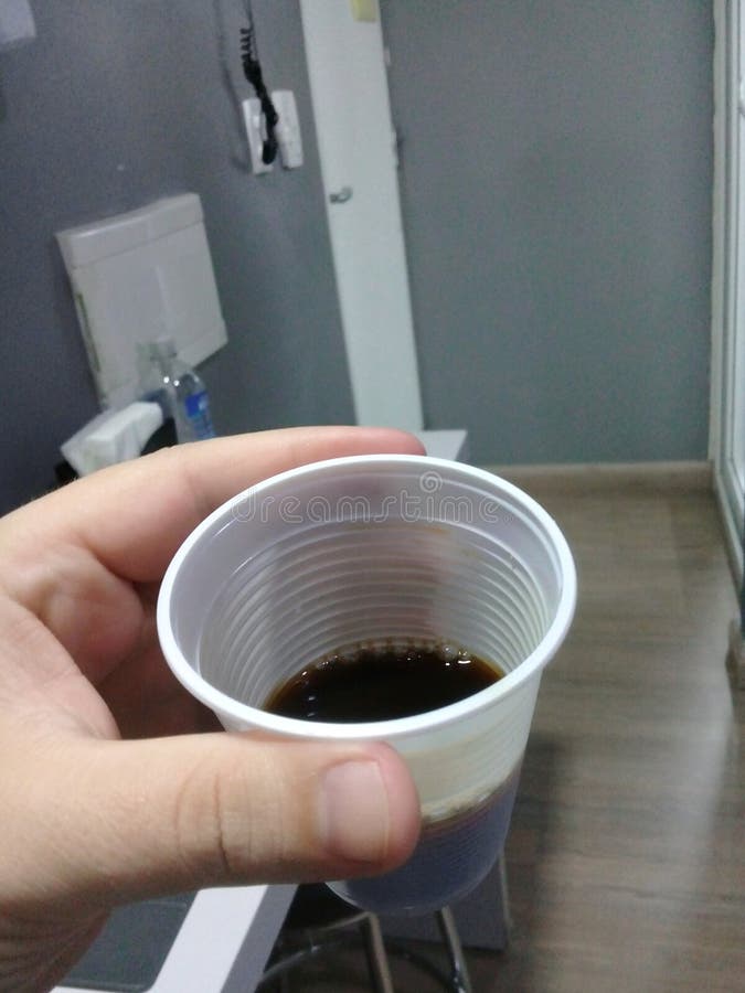 Hand Holding a Small Recyclable Plastic Cup with Coffee Stock Image ...
