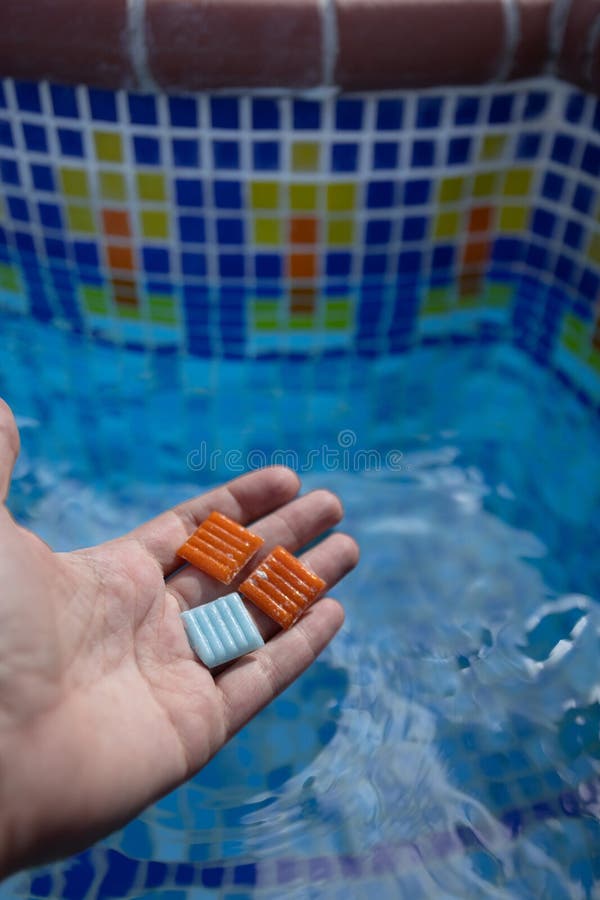 Hand Holding Small Tile from Walls of Swimming Pool. Design of the ...